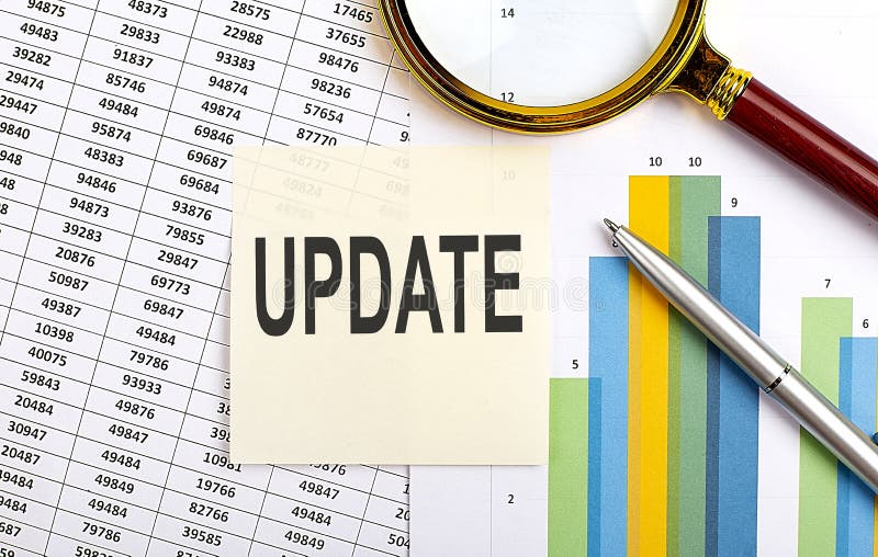 BUSINESS UPDATE Text on the Sticker through Magnifier. View from Above ...