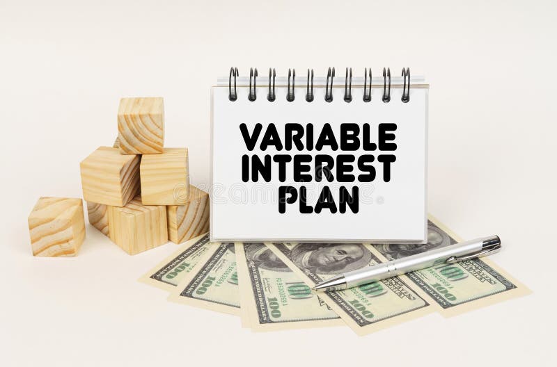 On a White Surface, Cubes, Dollars, a Pen and a Notepad with the ...