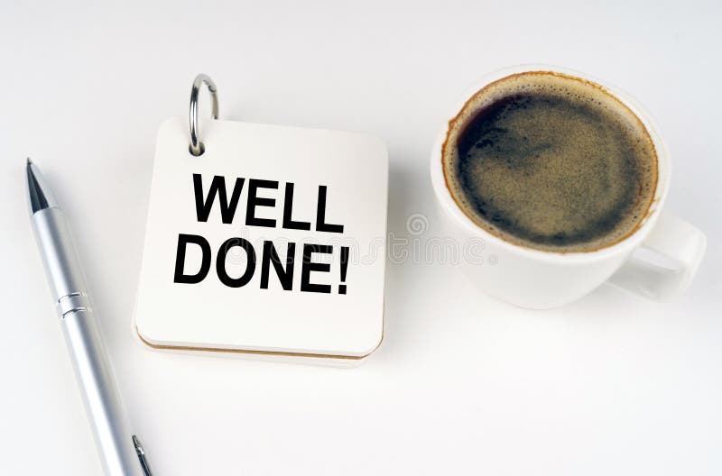 On a White Surface, a Cup of Coffee, a Pen and a Notepad with the ...