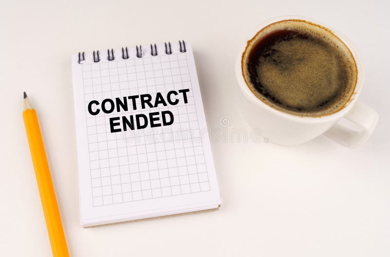 On a White Surface, a Cup of Coffee, a Pencil and a Notepad with the ...