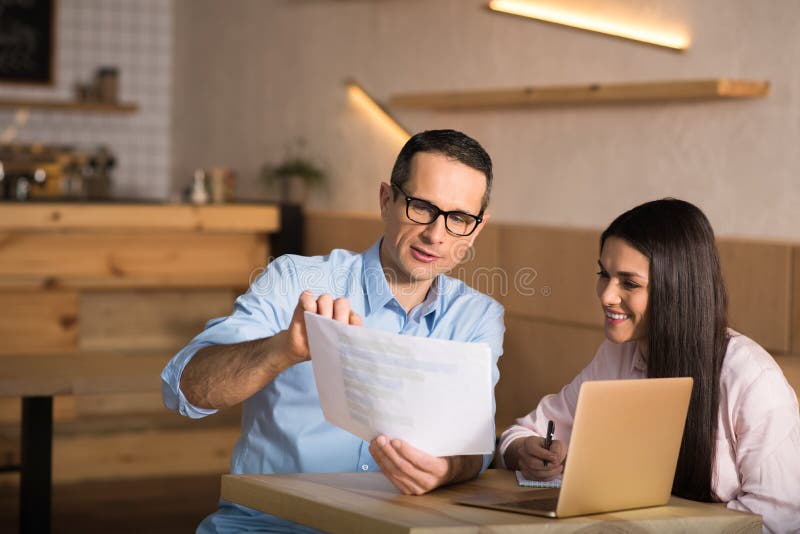 Business Couple Looking at Documents Stock Photo - Image of adult ...