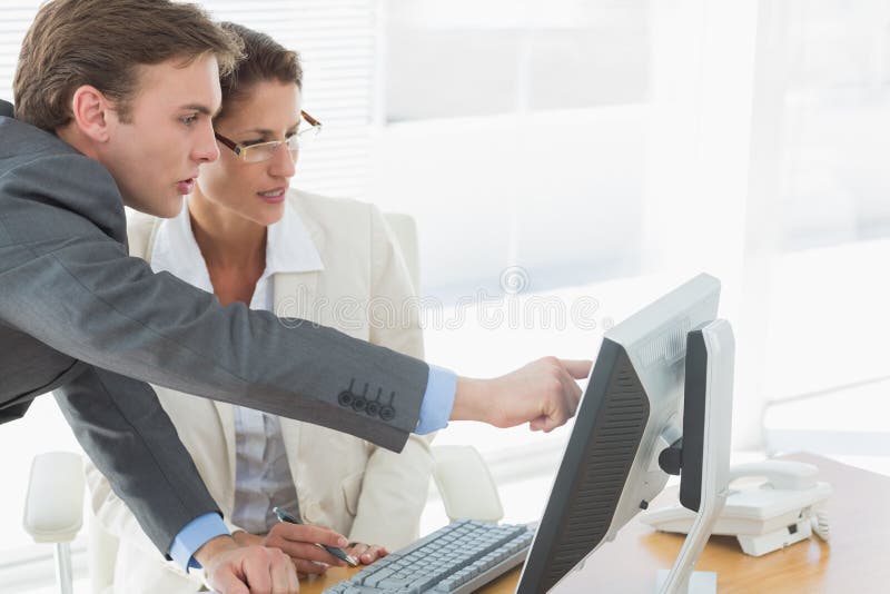 Business Couple Using Computer at Office Desk Stock Image - Image of ...