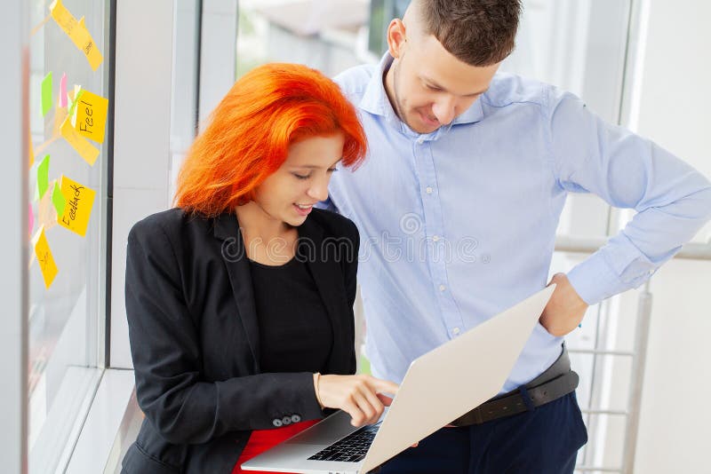 Business Couple Working Together on Project at Modern Office Stock ...