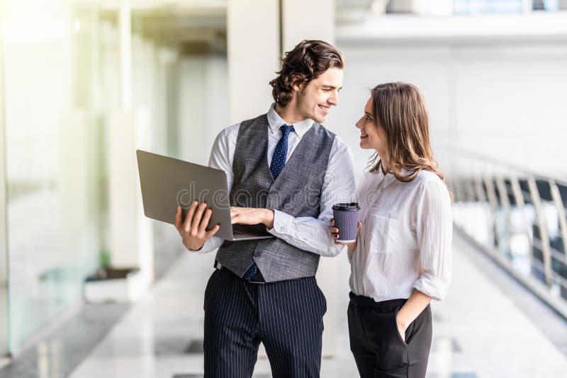 Business Couple Working Together on Project at Modern Startup in the ...