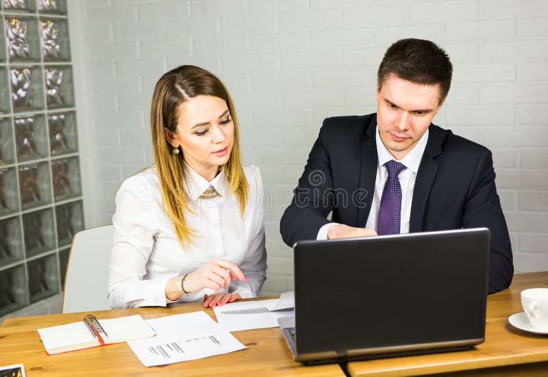 Business Couple Working Together on Project at Modern Startup Office ...