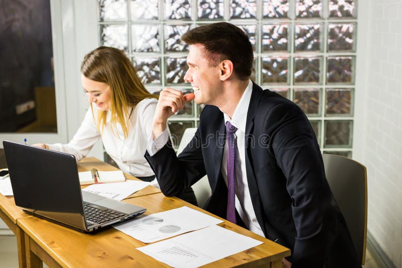 Business Couple Working Together on Project at Office Stock Photo ...