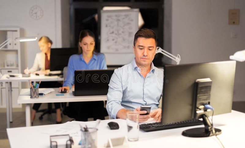 Man with Smartphone Working at Night Office Stock Image - Image of ...