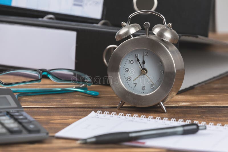 Business Desk with Clock, Calendar, Calculator and Glasses Stock Photo ...