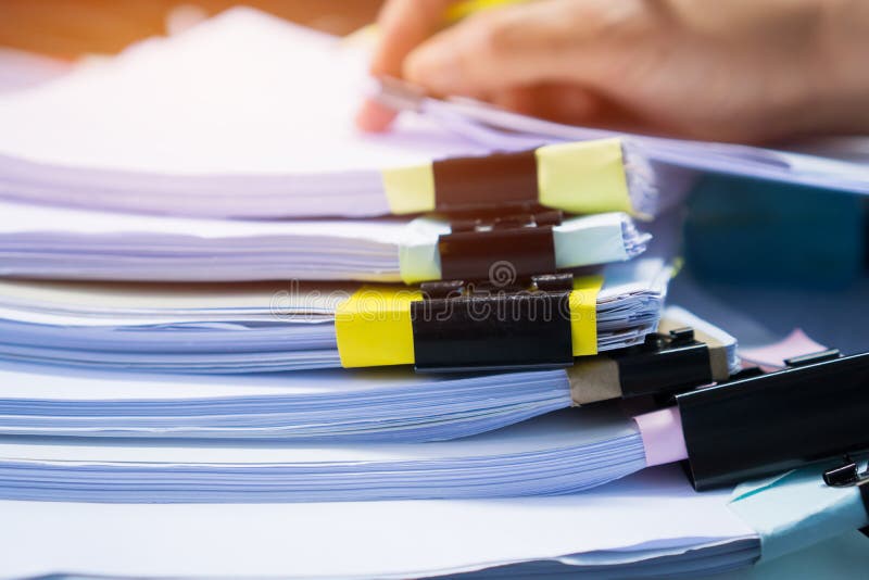 Business Documents Concept : Businessman Hands Working in Stacks Paper ...