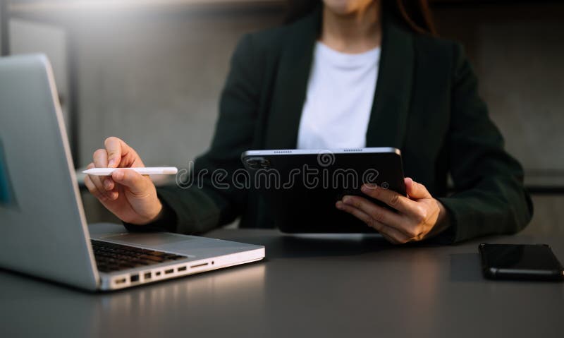 Business Documents on Office Desk with Laptop and Smart Phone and Graph ...