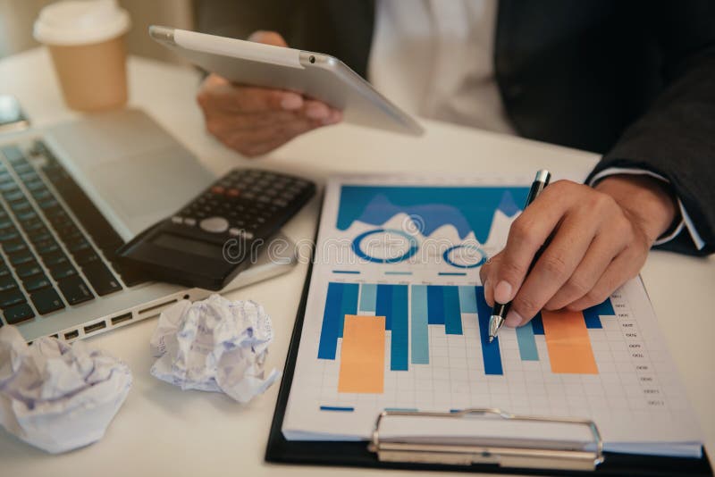 Business Documents on Office Table with Laptop and Digital Tablet and ...