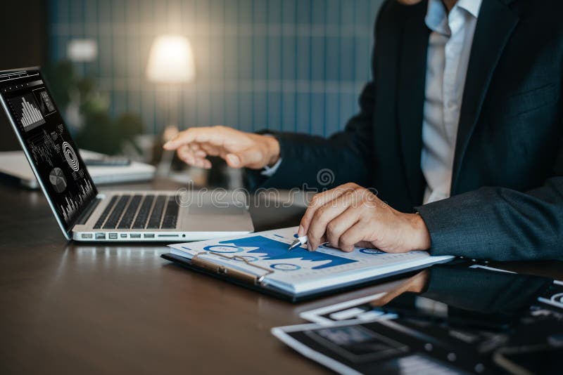 Business Documents on Office Table with Laptop and Digital Tablet and ...
