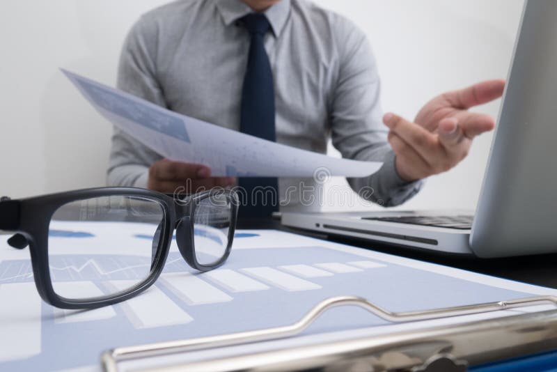 Business Documents on Office Table with Smart Phone and Digital Stock ...