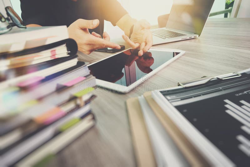 Business Documents on Office Table with Smart Phone and Digital Stock ...