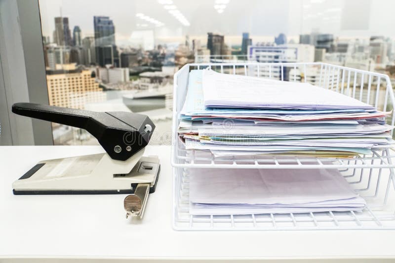 Business Documents Stack in Box with Big Paper Punch Stock Photo ...