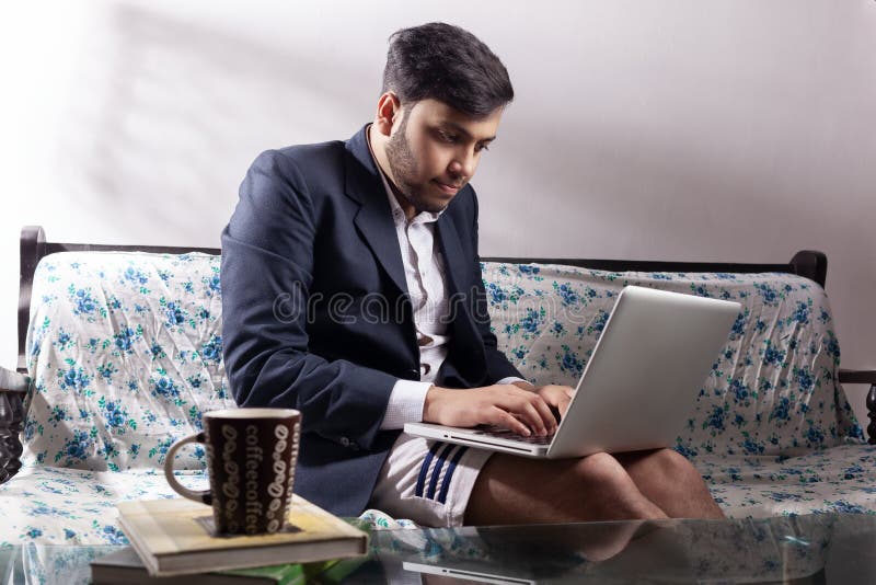 Business Employee Using Computer Sitting on Sofa Stock Photo - Image of ...