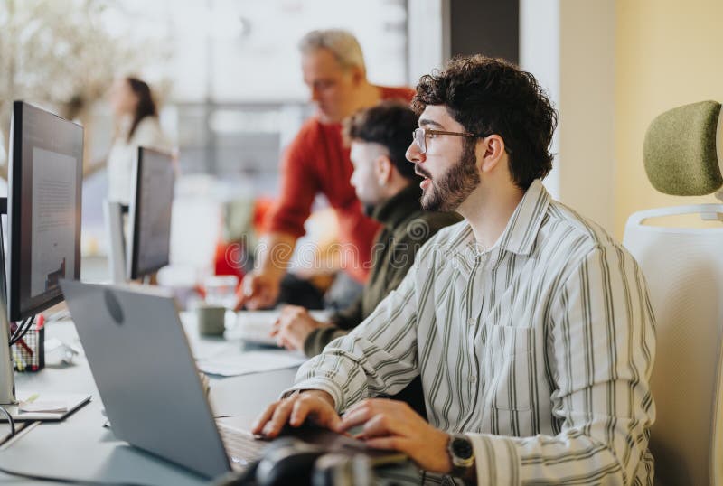 Business Employees Collaborating, Analyzing Data, and Strategizing in a ...