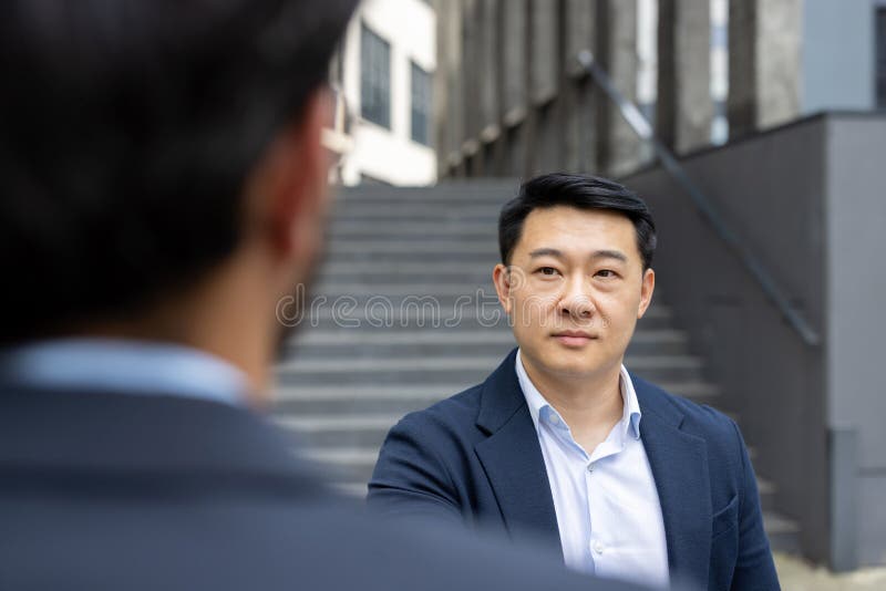 Business Encounter between Professionals Outdoors with Urban Background ...