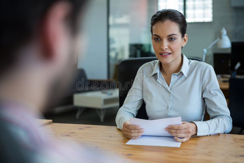 Business Executive Conducting Job Interview with Man Stock Photo ...