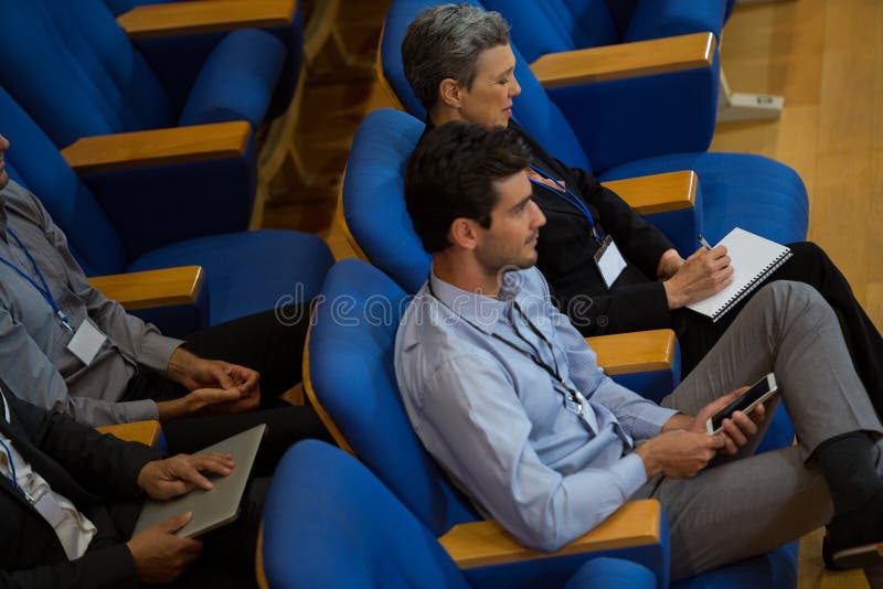 Business Executive Participating in a Business Meeting Taking Notes ...