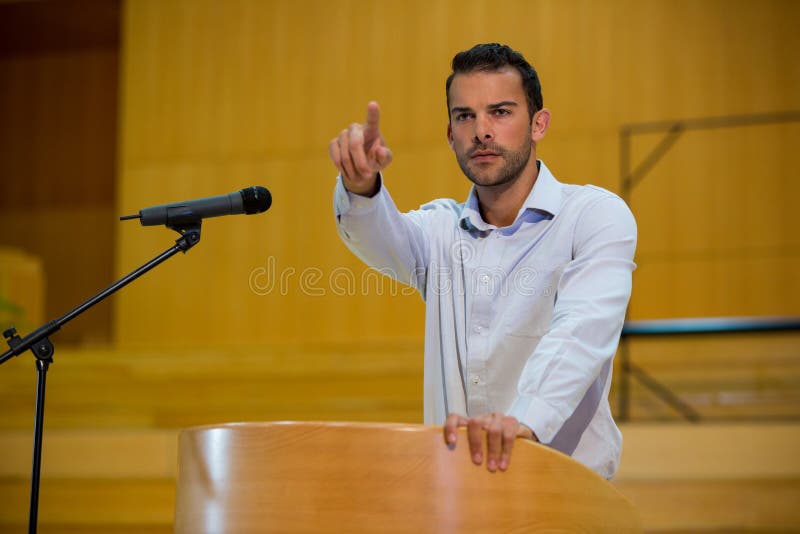 Business Executive Pointing while Giving a Speech Stock Image - Image ...
