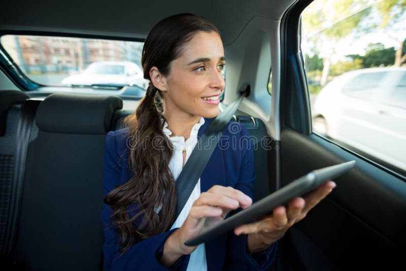 Business Executive Using Digital Tablet in Car Stock Image - Image of ...