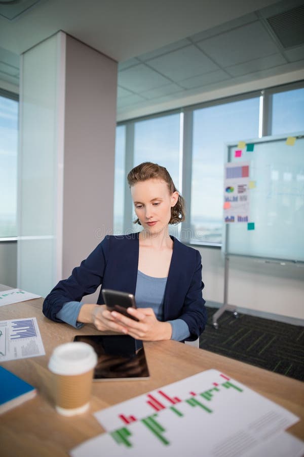 Business Executive Using Her Mobile Phone Stock Photo - Image of ...
