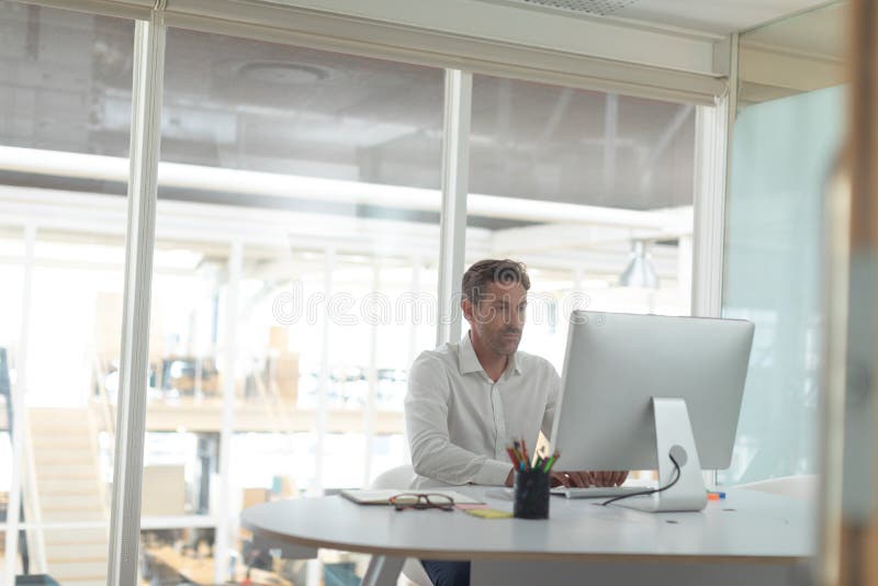 Business Executive Working on Computer at Desk in a Modern Office Stock ...