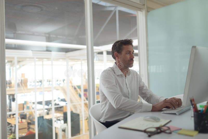 Business Executive Working on Computer at Desk in a Modern Office Stock ...