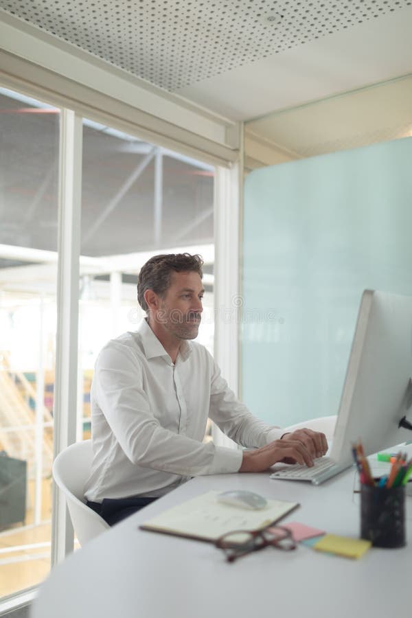 Business Executive Working on Computer at Desk in a Modern Office Stock ...