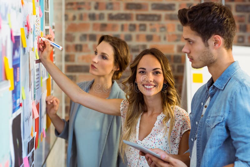 Business Executive Writing on Sticky Notes on Whiteboard Stock Photo ...