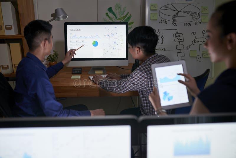 Business Executives Discussing Chart Stock Photo - Image of office ...