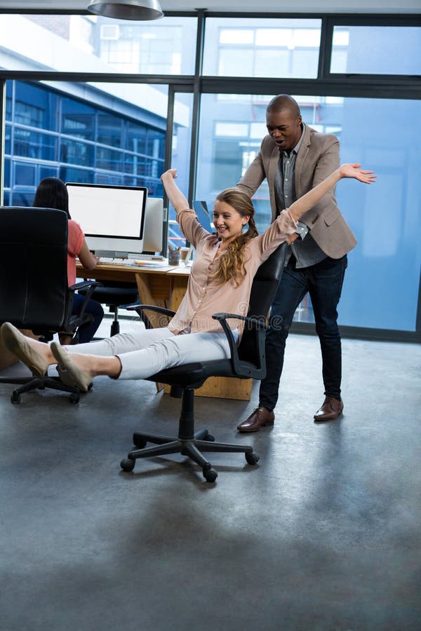 Business Executives Having Fun in Office Stock Photo - Image of chair ...