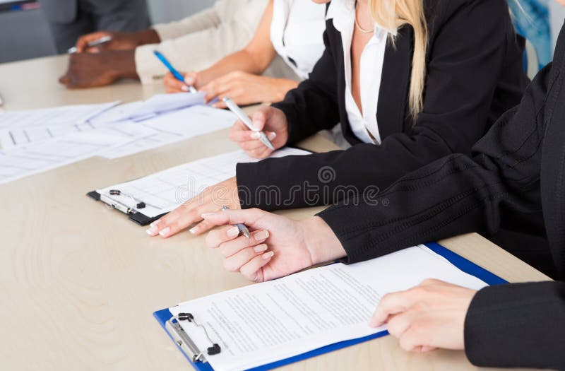 Business Executives Taking Notes during a Meeting Stock Image - Image ...