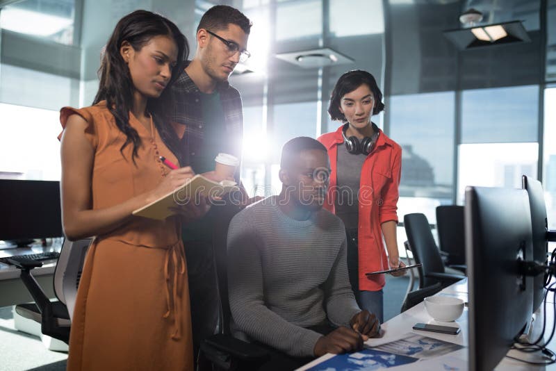 Business Executives Working at Desk Stock Image - Image of four ...