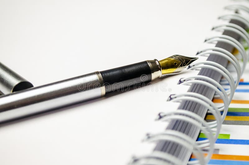 Business Finance and Accounting Concept. Pen, Notepad and Charts Stock ...