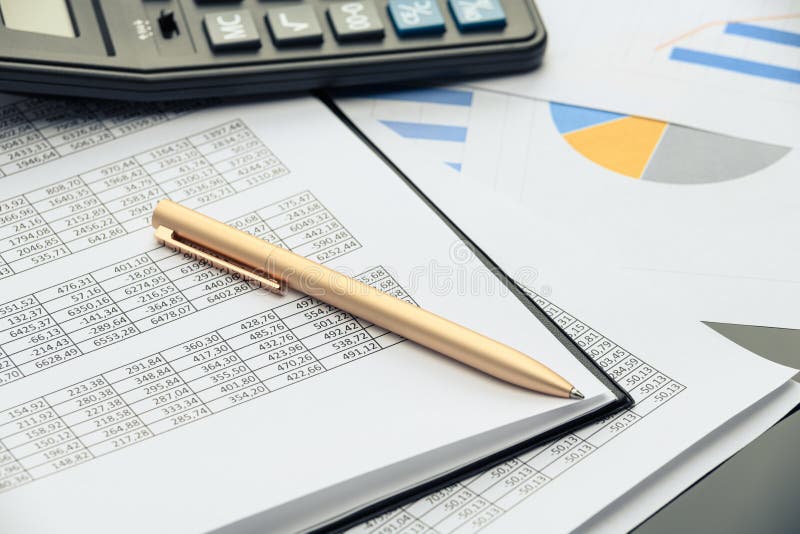 Business Financial Documents, Office Calculator and Pen on the Table ...