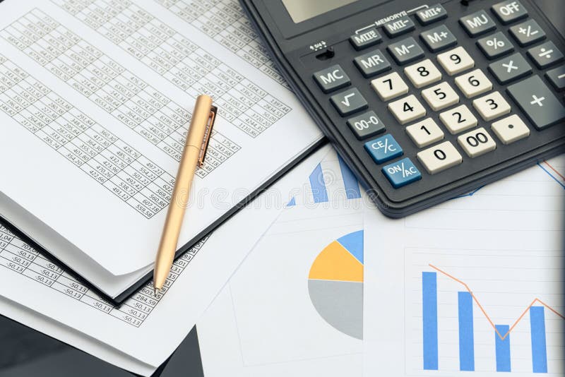 Business Financial Documents, Office Calculator and Pen on the Table ...