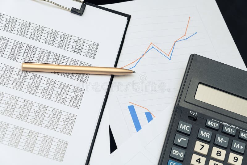 Business Financial Documents, Office Calculator and Pen on the Table ...