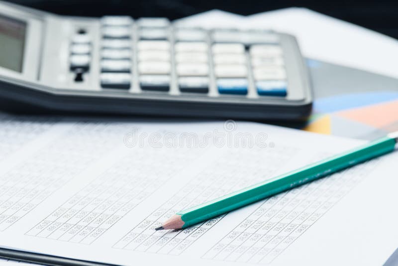 Business Financial Documents, Office Calculator and Pen on the Table ...