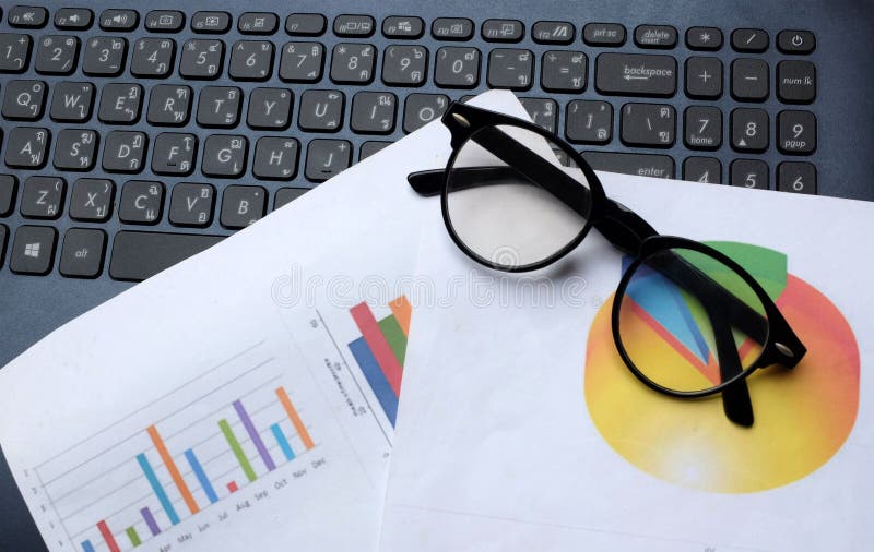 Business Graphs, Charts, Pen, and Glasses ,laptop Computer on Table ...