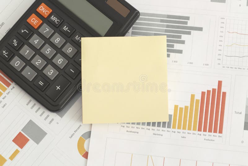 Business Graphs, Charts, Sticky Notes and Calculator on Table ...