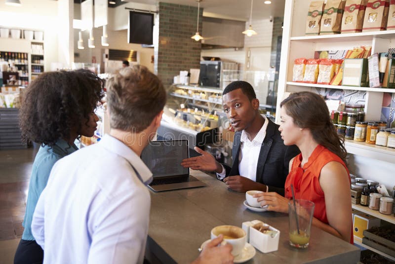 Business Group Having Informal Meeting in Cafe Stock Photo - Image of ...