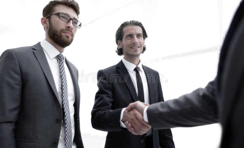 Business Group Welcomes Partner with a Handshake Stock Image - Image of ...