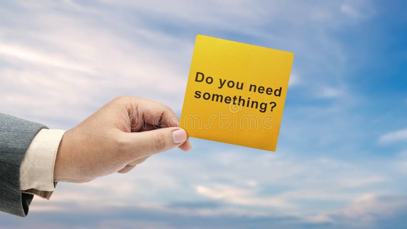 Business Hand Holding a Note with Do You Need Something Text Stock ...