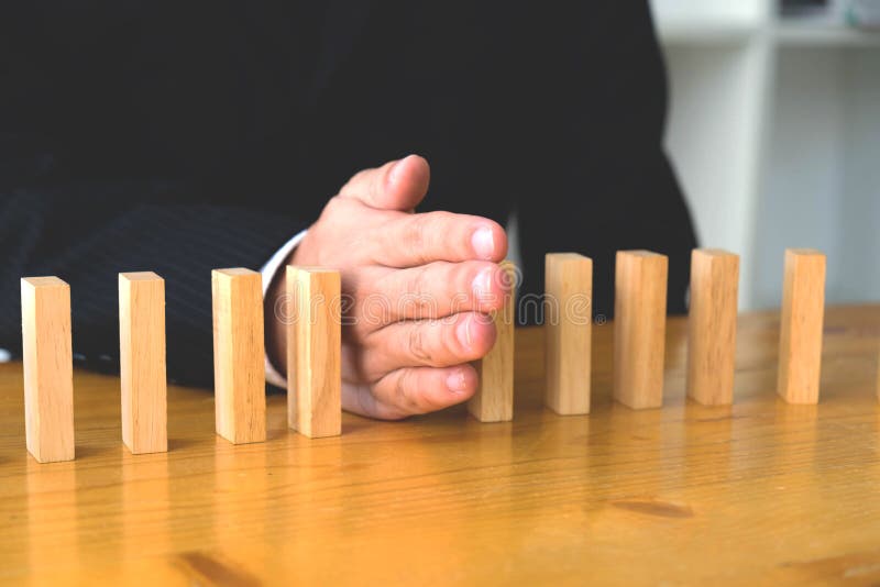 Business Hand Stops Domino Continuous Overturned Meaning that Hindered ...
