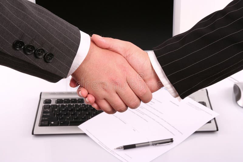 Handshake through computer stock photo. Image of hand - 4542818