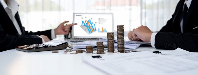 Business Intelligence Analyst Use BI Software on Laptop with Stack Coin ...