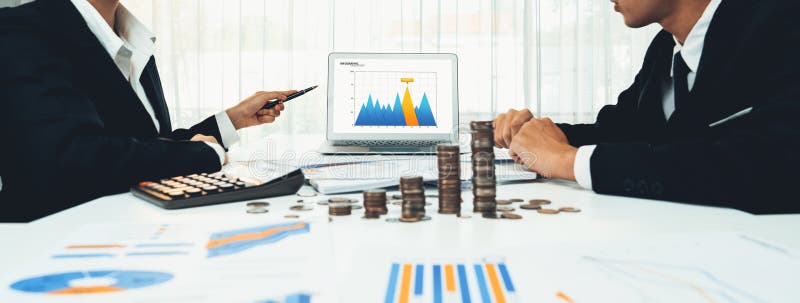 Business Intelligence Analyst Use BI Software on Laptop with Stack Coin ...