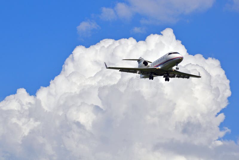 Business jet in the sky stock photo. Image of cloudy - 33969700